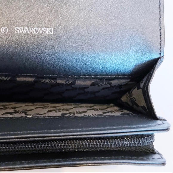 Swarovski | Bags | Swarovski Swan Embellished Bronze Calfskin Bifold ...